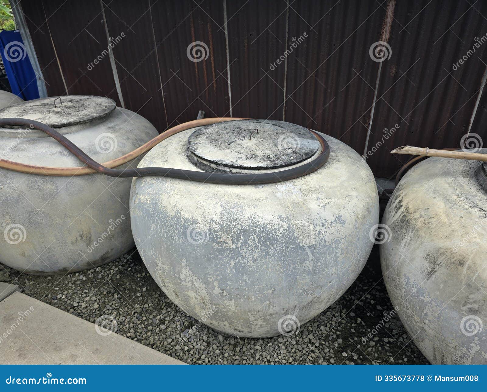 Old Metal Barrel with a Lid on the Ground Stock Photo - Image of ground ...