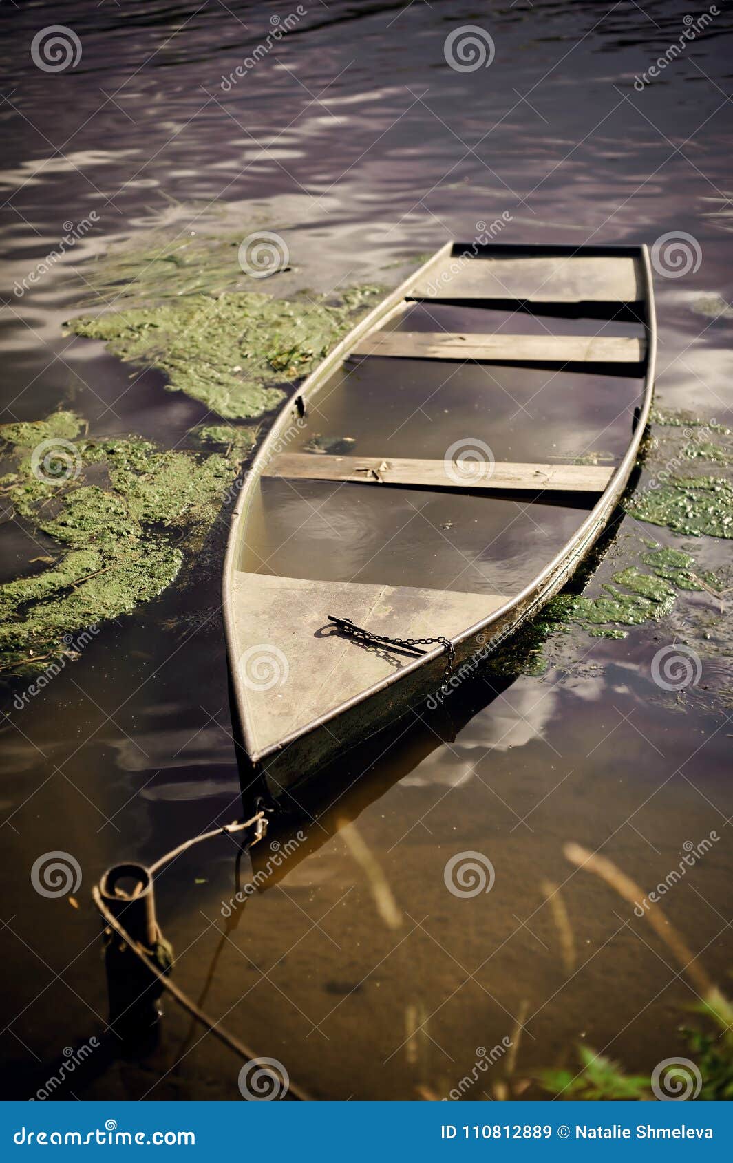 Old boat in water stock image. Image of green, metal - 110812889