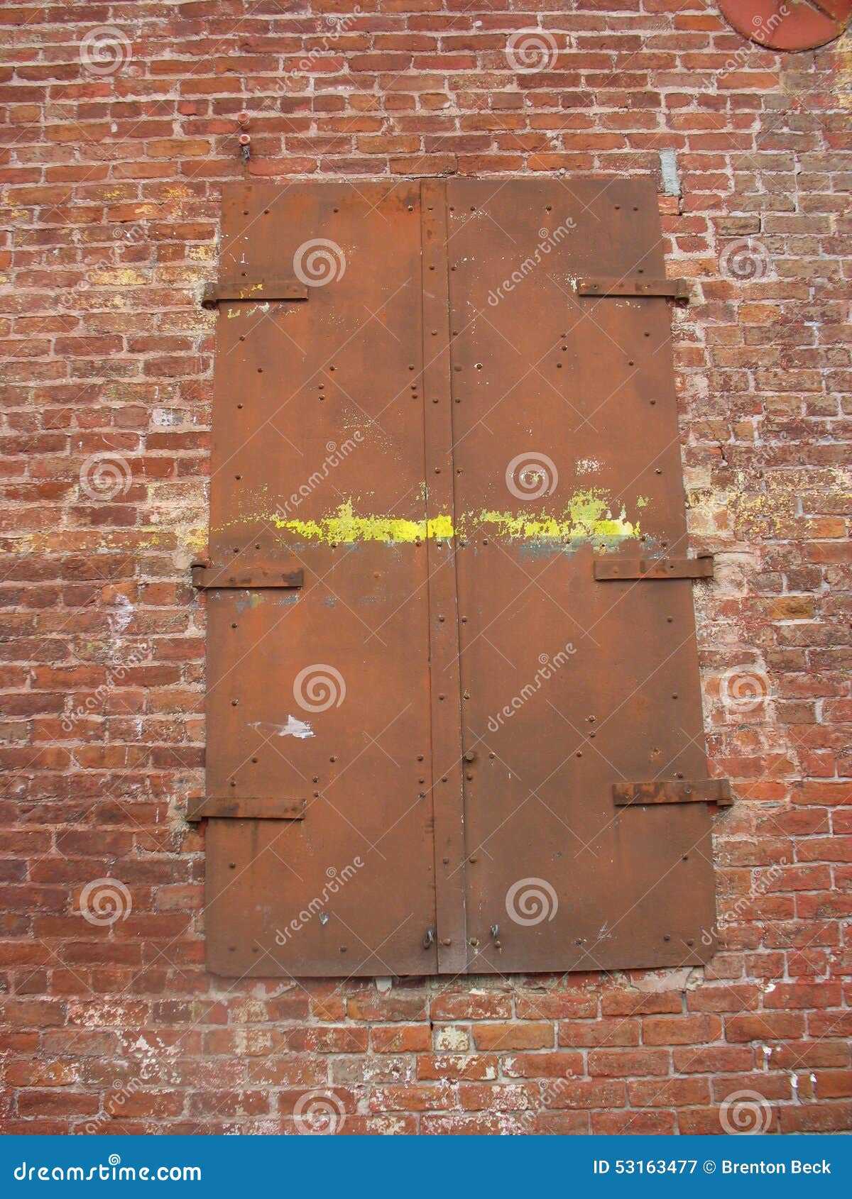 Old Metal Door in a Brick Wall Stock Image - Image of wall, bricks ...