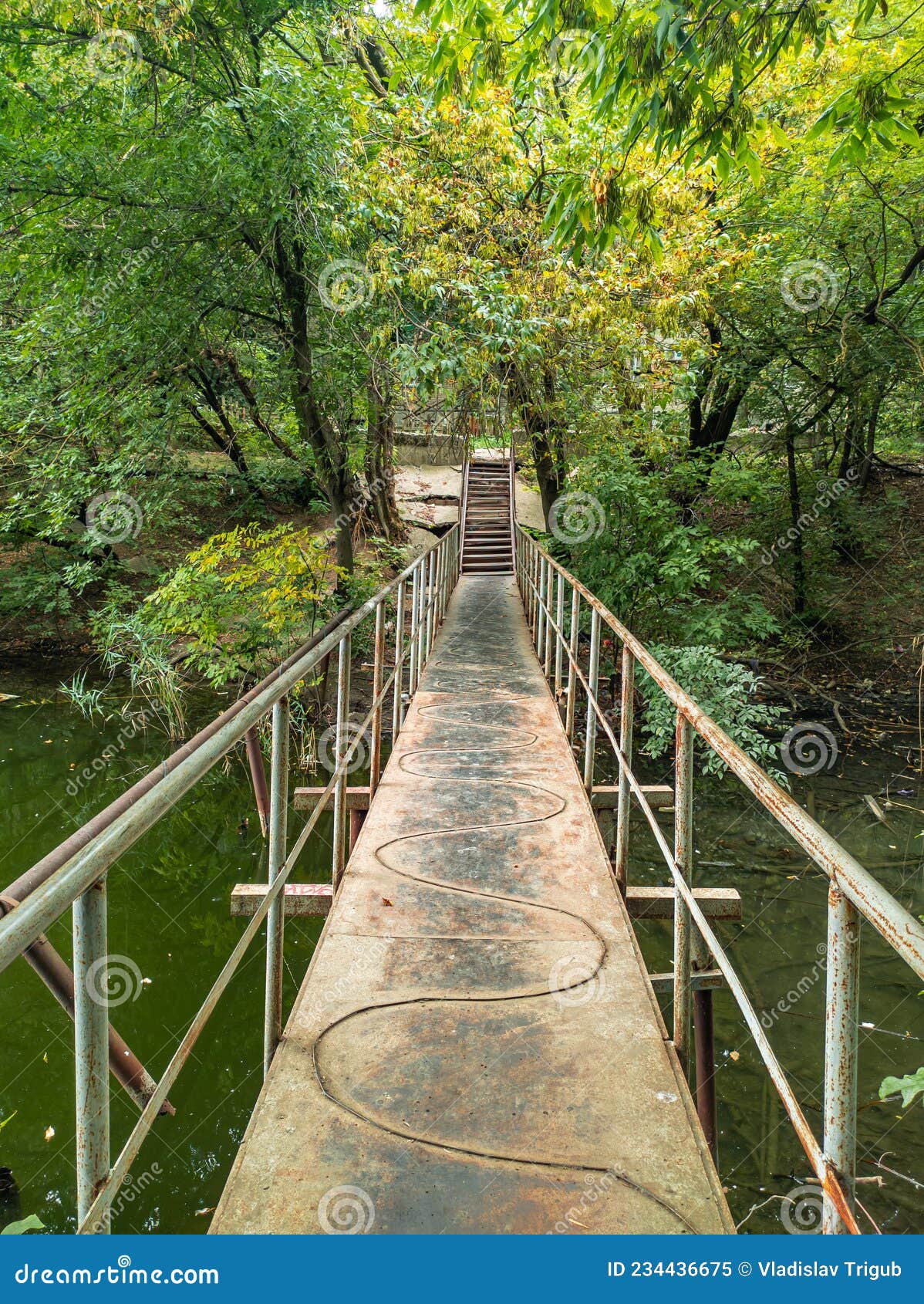 Old Metal Rusty Footbridge Over the River in the Park. Stock Image ...
