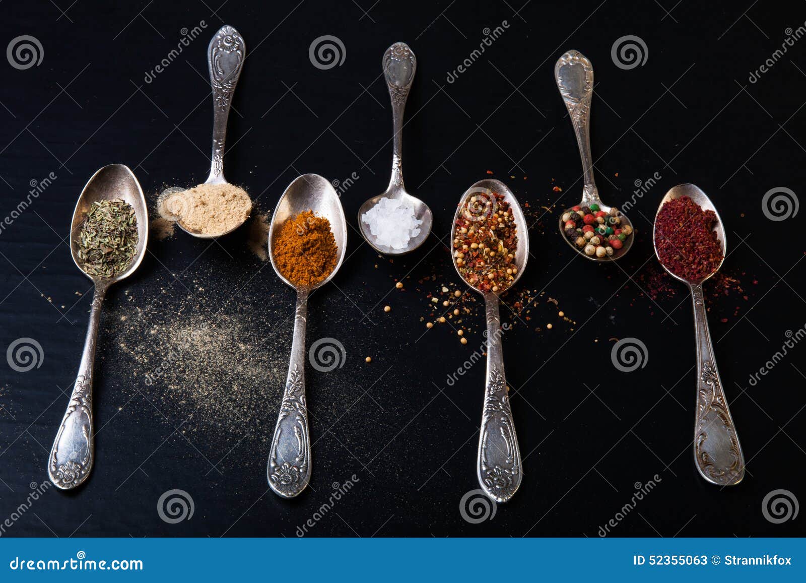 Old Metal Spoons with Different Kind of Spices on a Black Backgr Stock ...