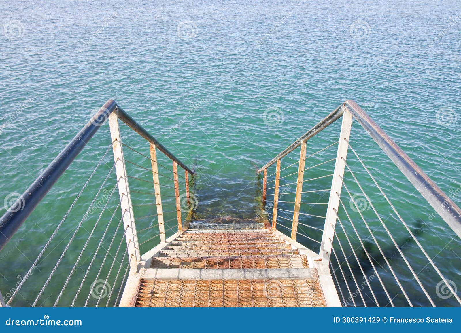 Old Metal Staircase Goes Down into the Water - Concept Image with Copy ... Old Metal Staircase Goes Down into the Water - Concept Image with Copy ...