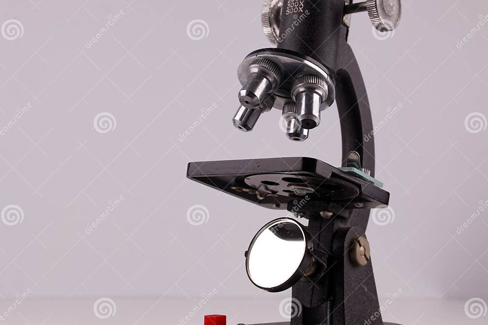 An Old Microscope Stands Isolated on a White Surface Stock Image ...