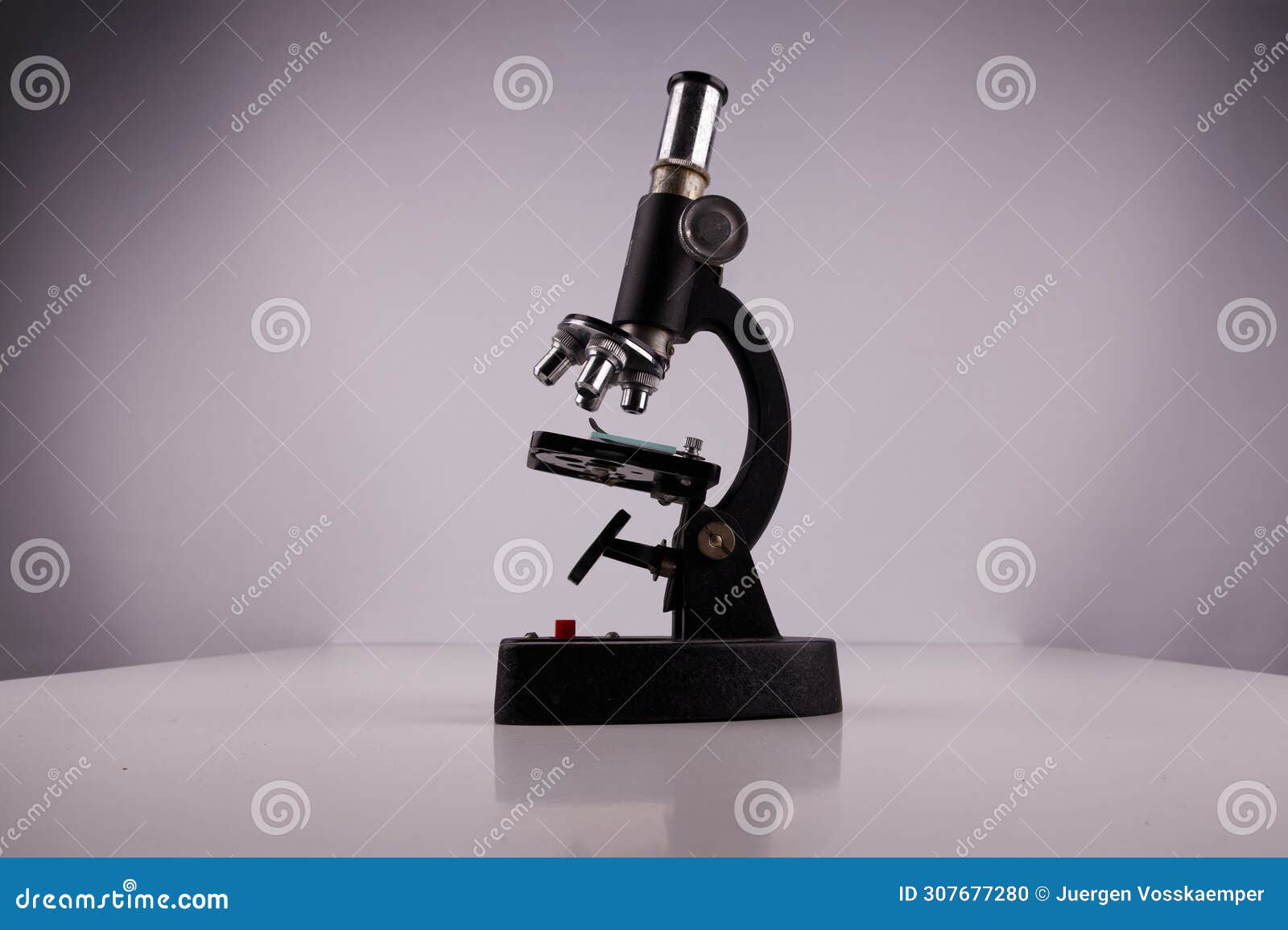 An Old Microscope Stands Isolated on a White Surface Stock Photo ...