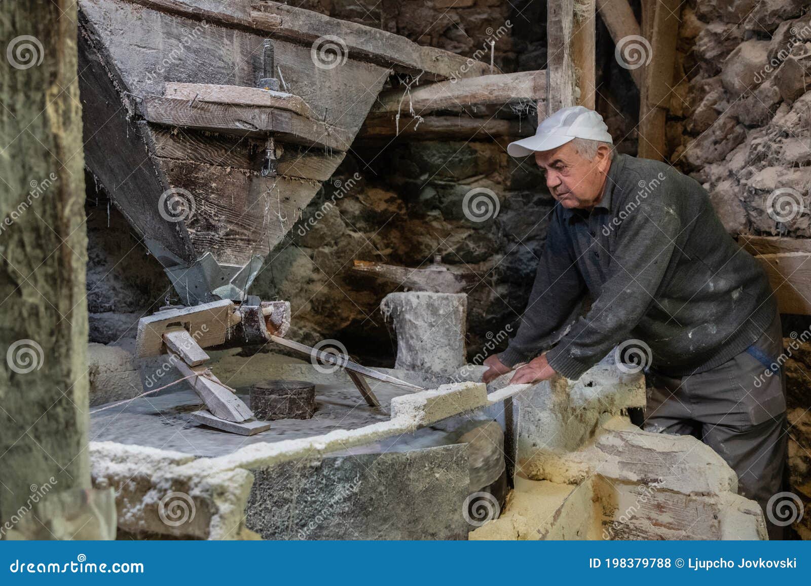 Old Mill For Grinding Olives. An Antique Machine For Producing Olive ...