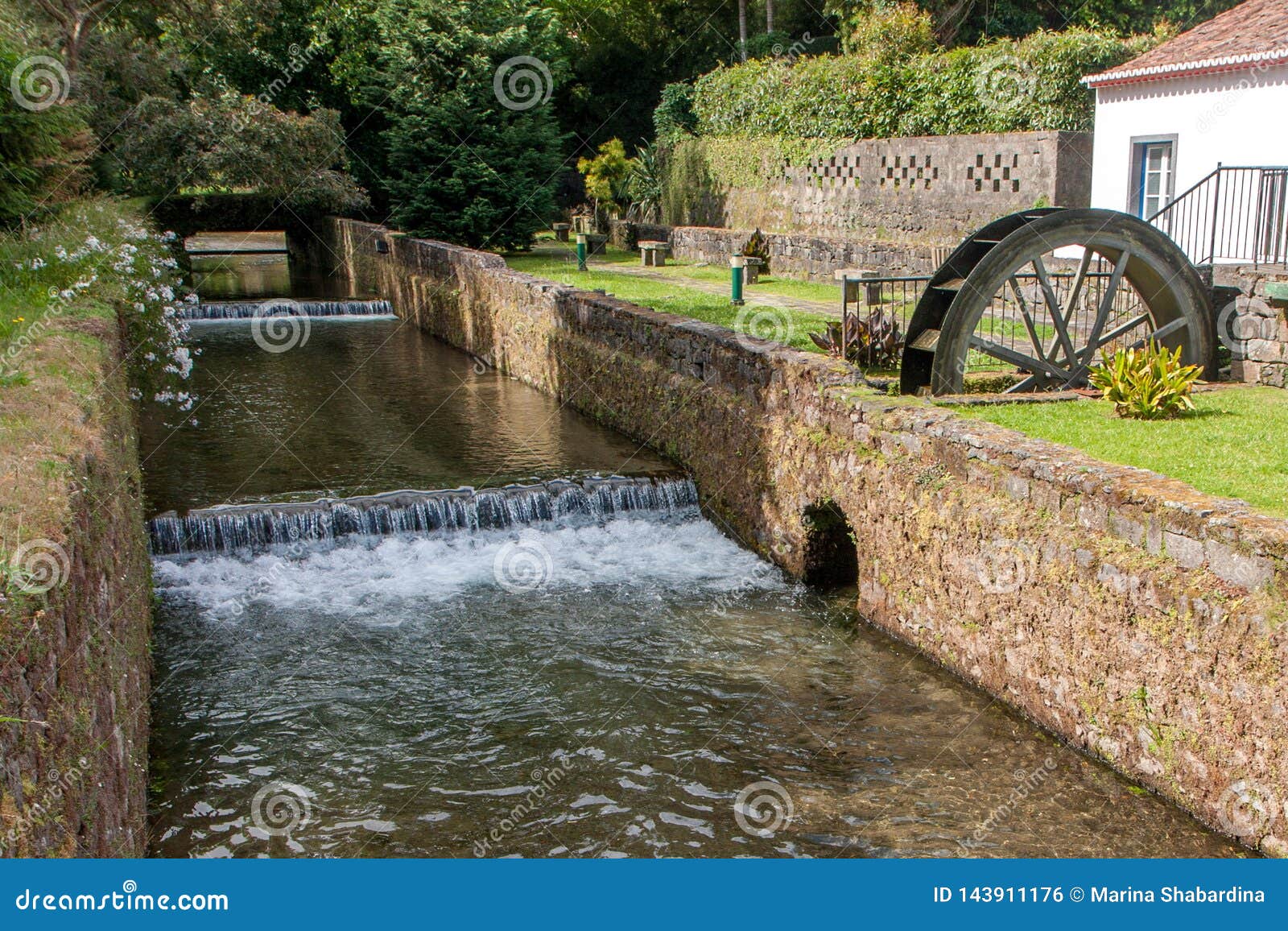 Old Mill with a Stream Enclosed in a Stone Channel with Brickwork Stock ...