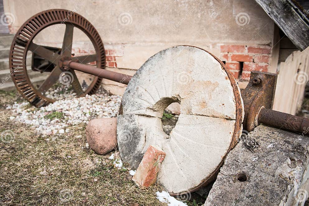 Old millstone at the mill stock image. Image of equipment - 214077221