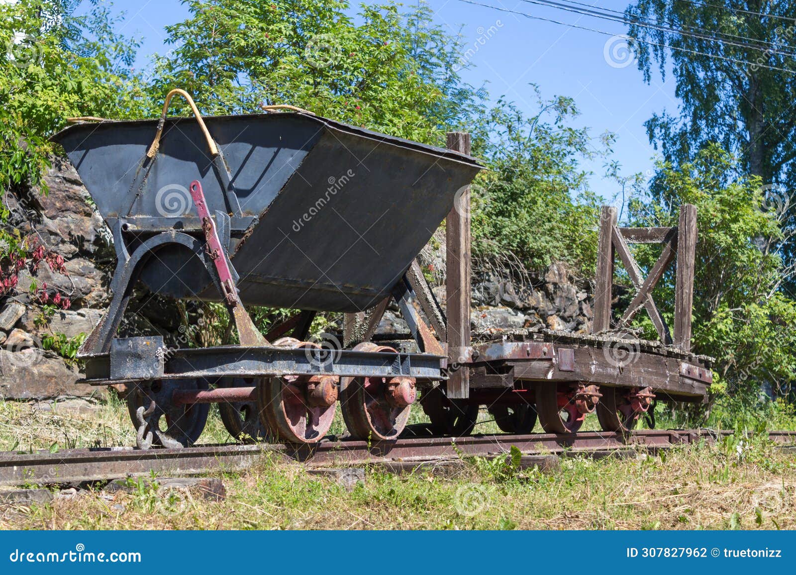 Old mining carts on track stock photo. Image of cart - 307827962