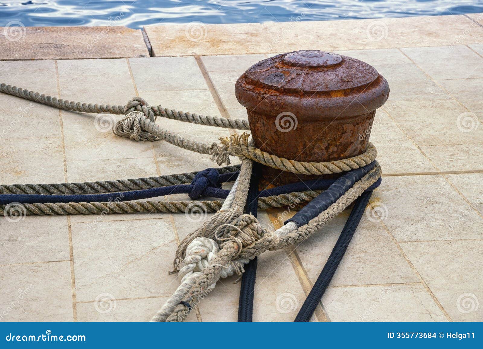 Old Mooring Bollard with Ropes on Wharf Stock Photo - Image of port ...