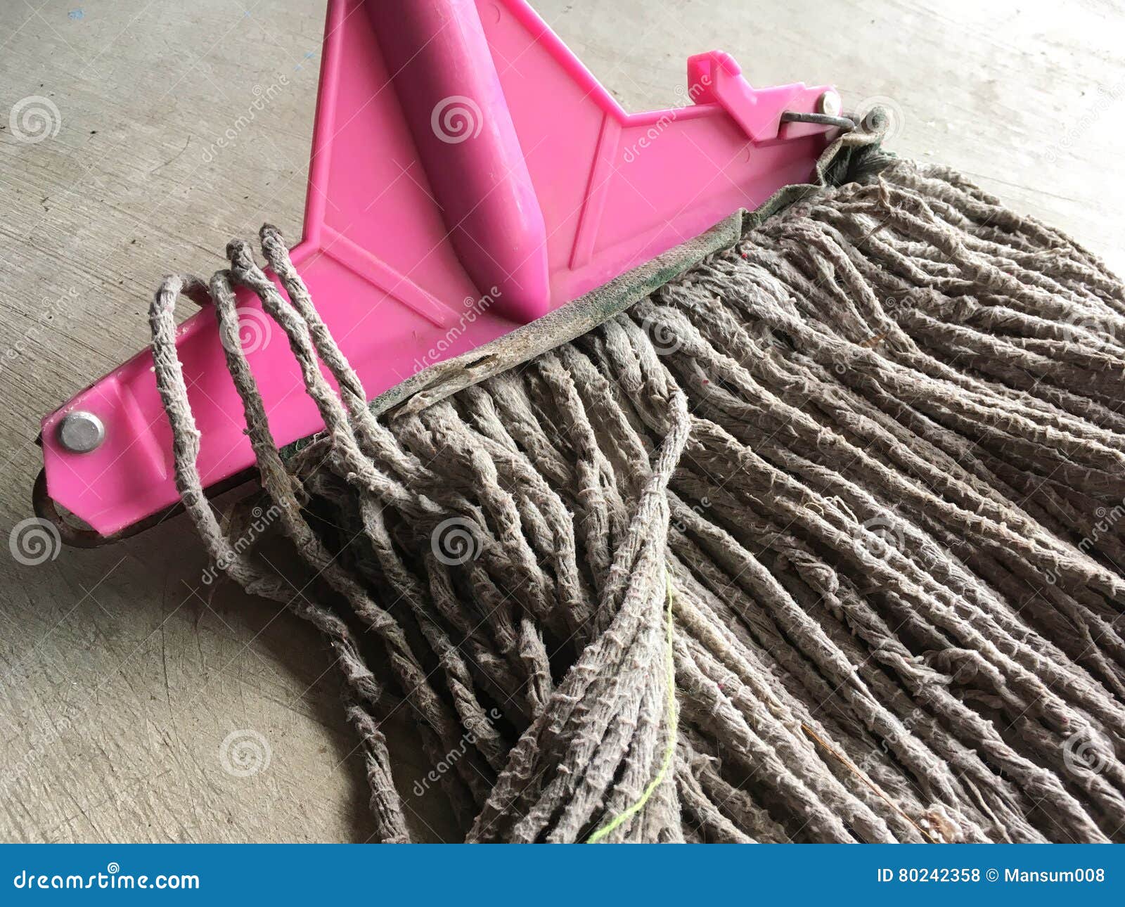 Old mop on cement floor stock photo. Image of fabric - 80242358