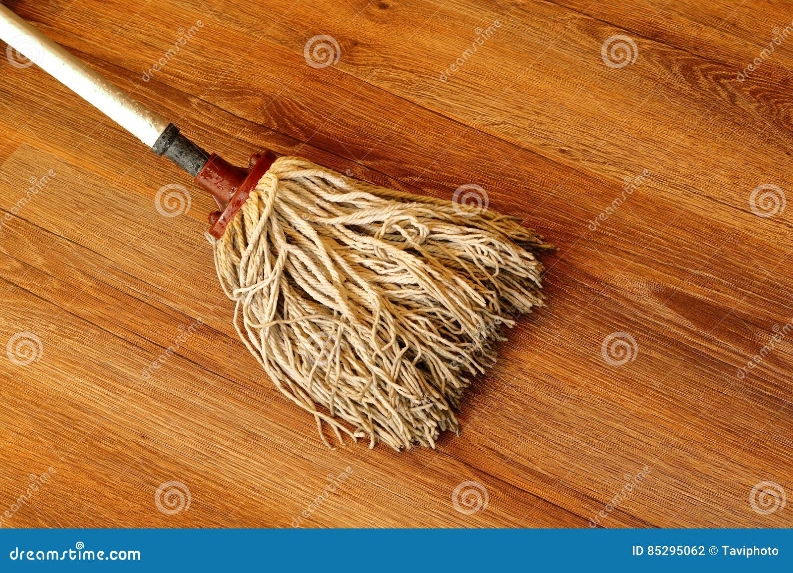 Old mop on wooden parquet stock photo. Image of hardwood - 85295062