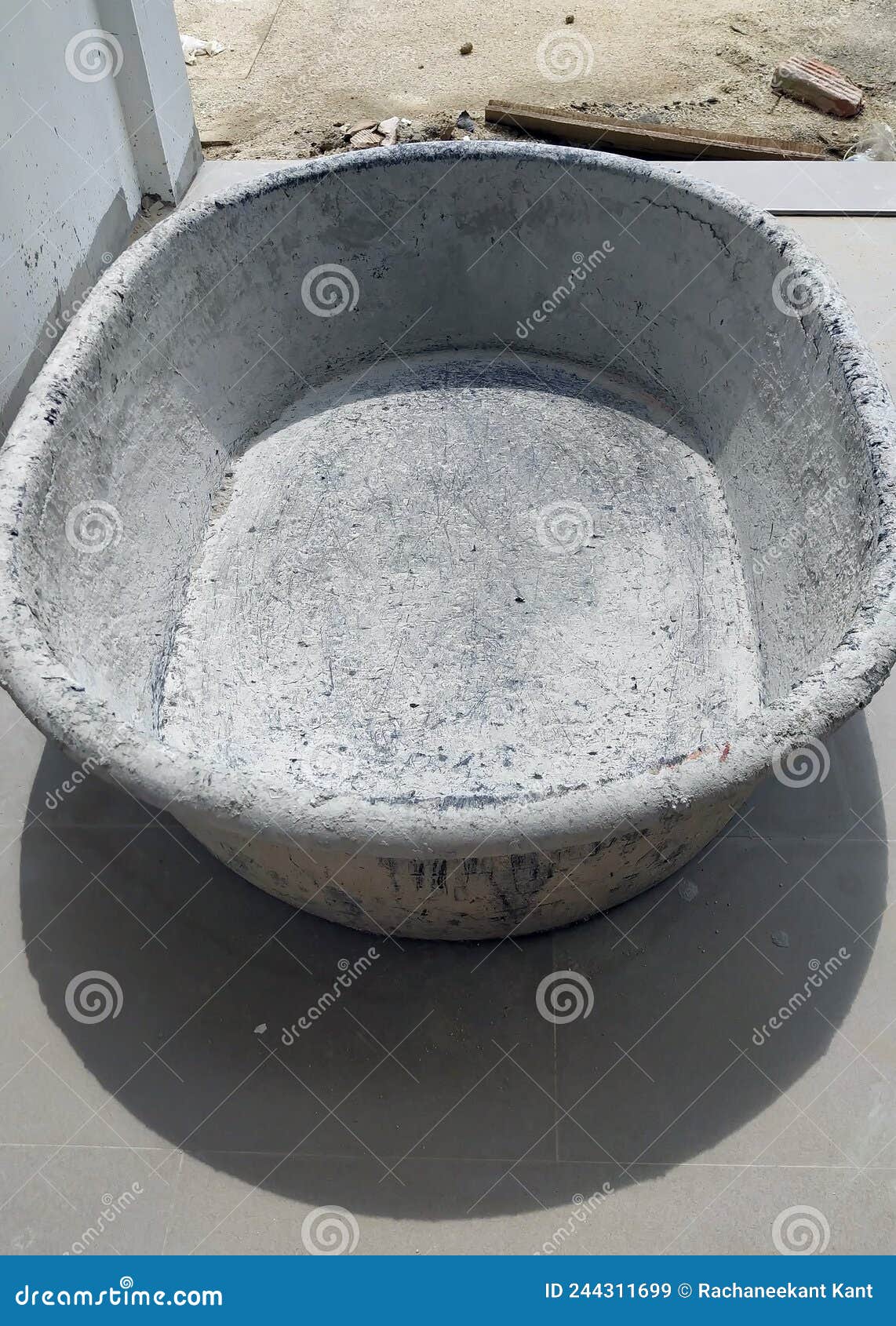 An Old Mortar Pan Set on a Sunlit Tiled Floor. Stock Image - Image of ...