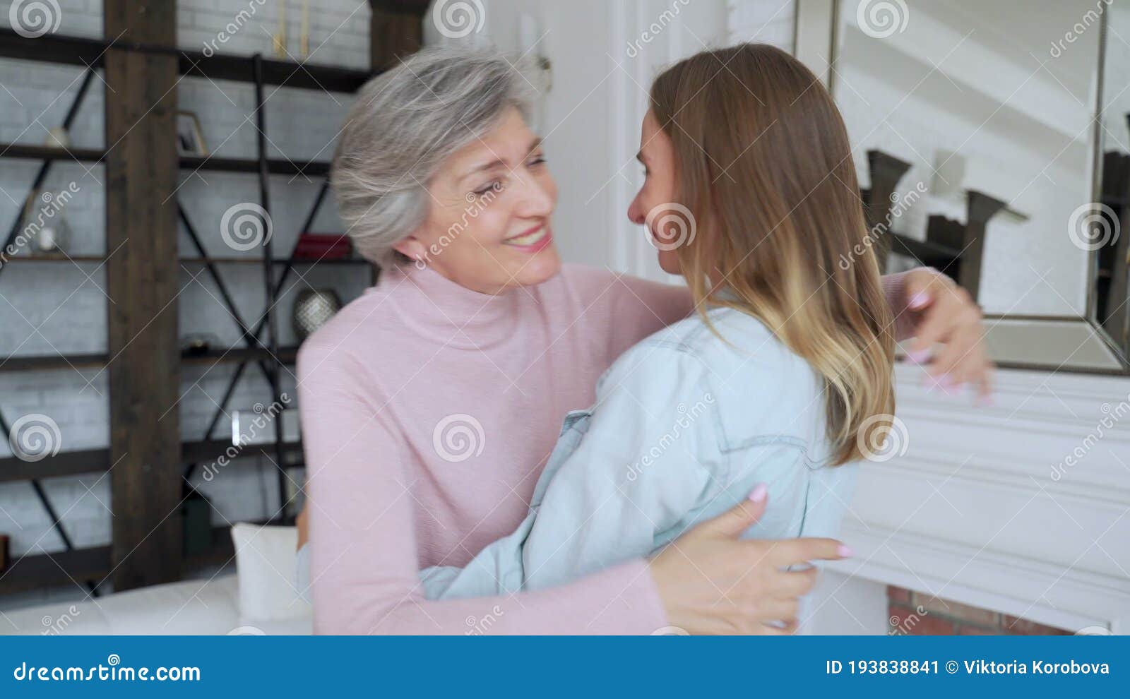 Old Mother And Mature Daughter Hugging At Home Happy Senior Mother And