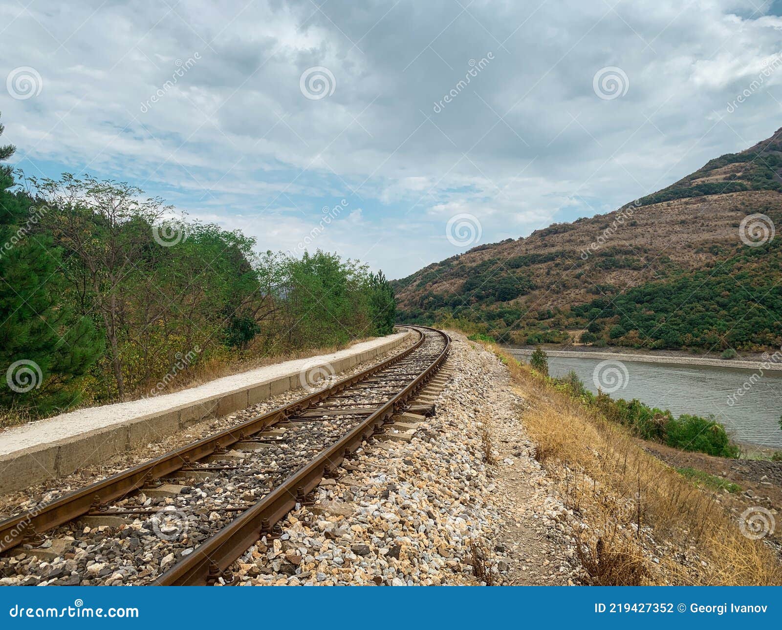 Old Mountain Railroad Track Leading between Forest and Lake. Stock ...