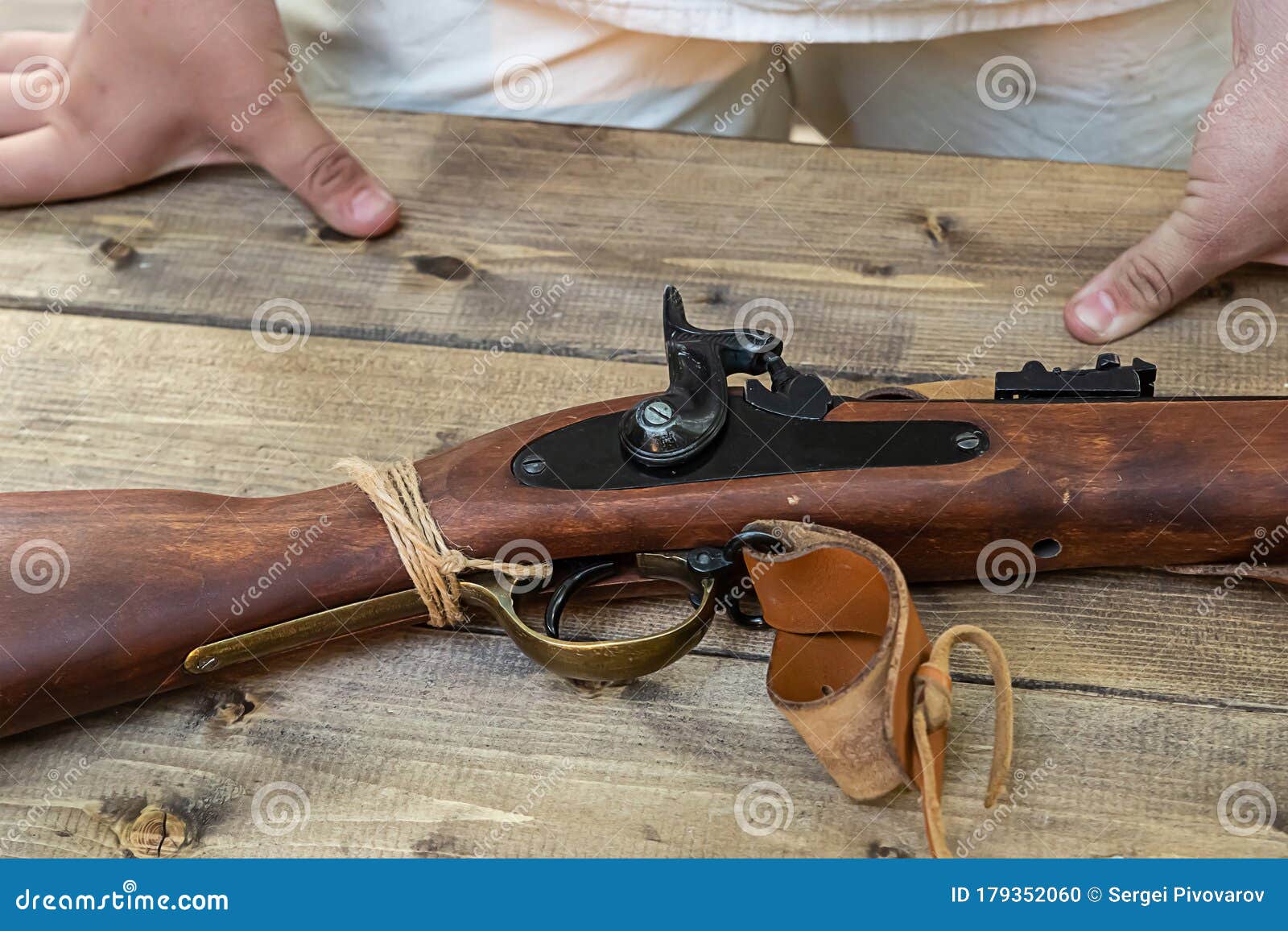Old Muzzle-loading Weapon, Trigger Traditional Musket on a Wooden Table ...