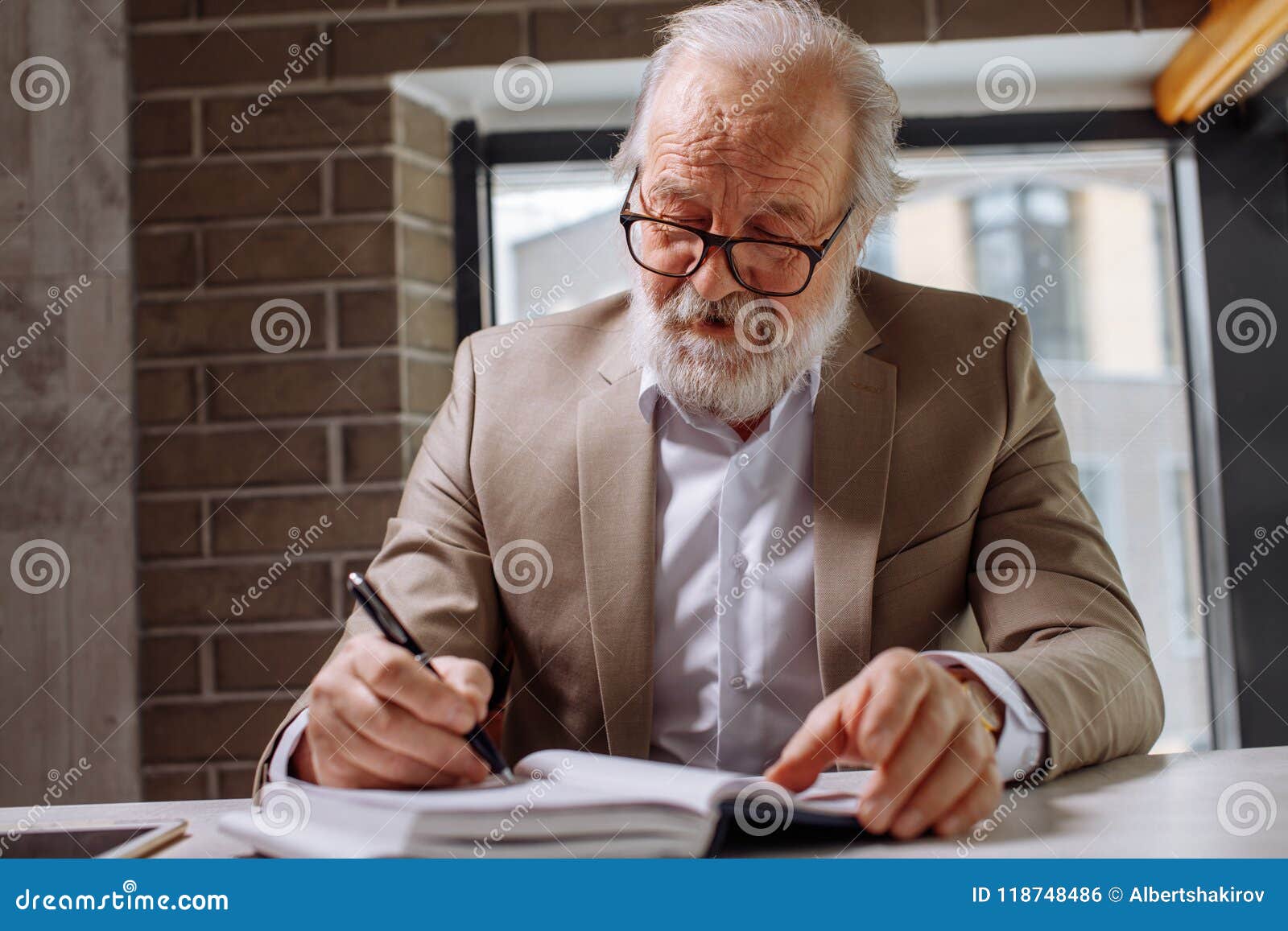 Old Writer in Smart Clothes is Constructing the Plot of the Novel Stock ...