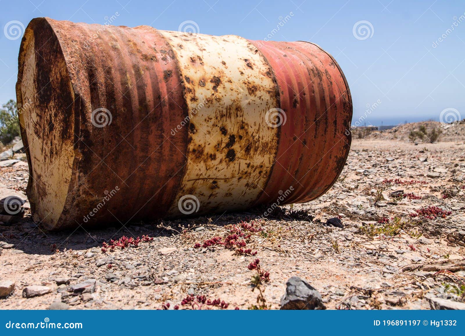 Old oil barrel in the sand stock image. Image of flow - 196891197