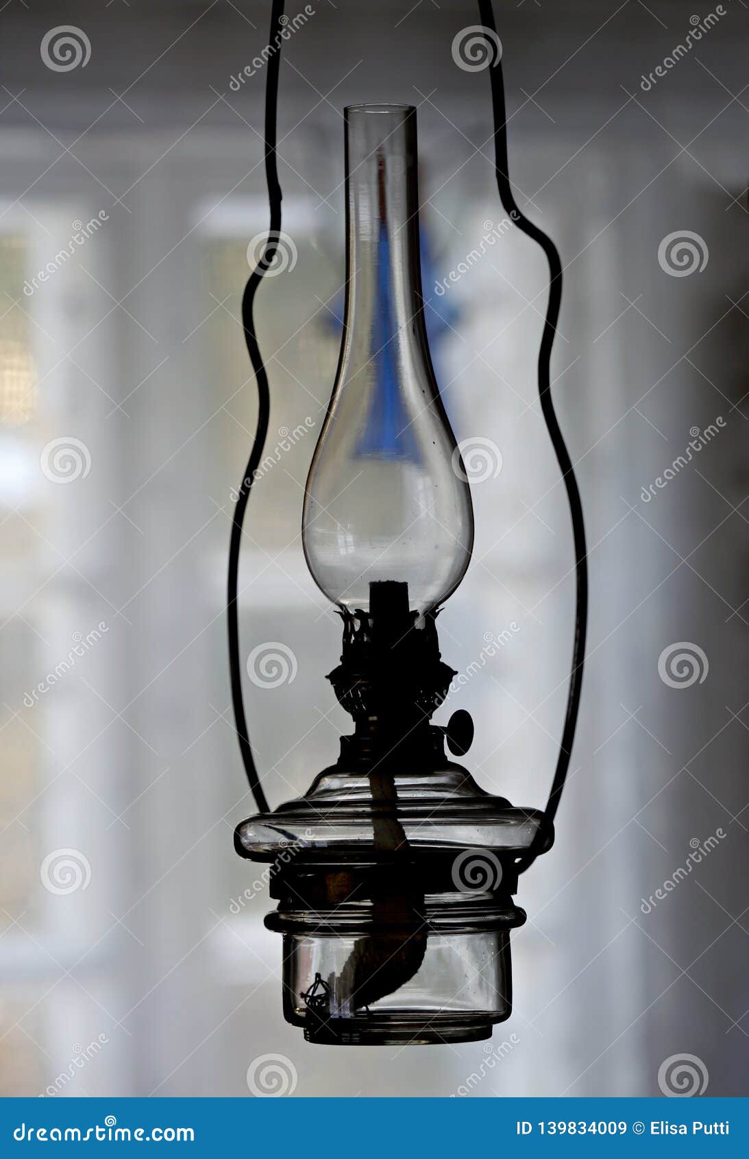 An Old Oil Lamp Against a Window Stock Image - Image of rustic ...