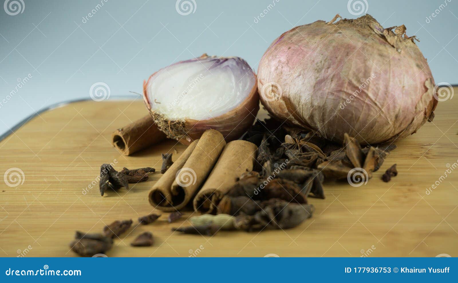 Old Onions with Different Spices Set on Wood Plate. Front View Stock ...