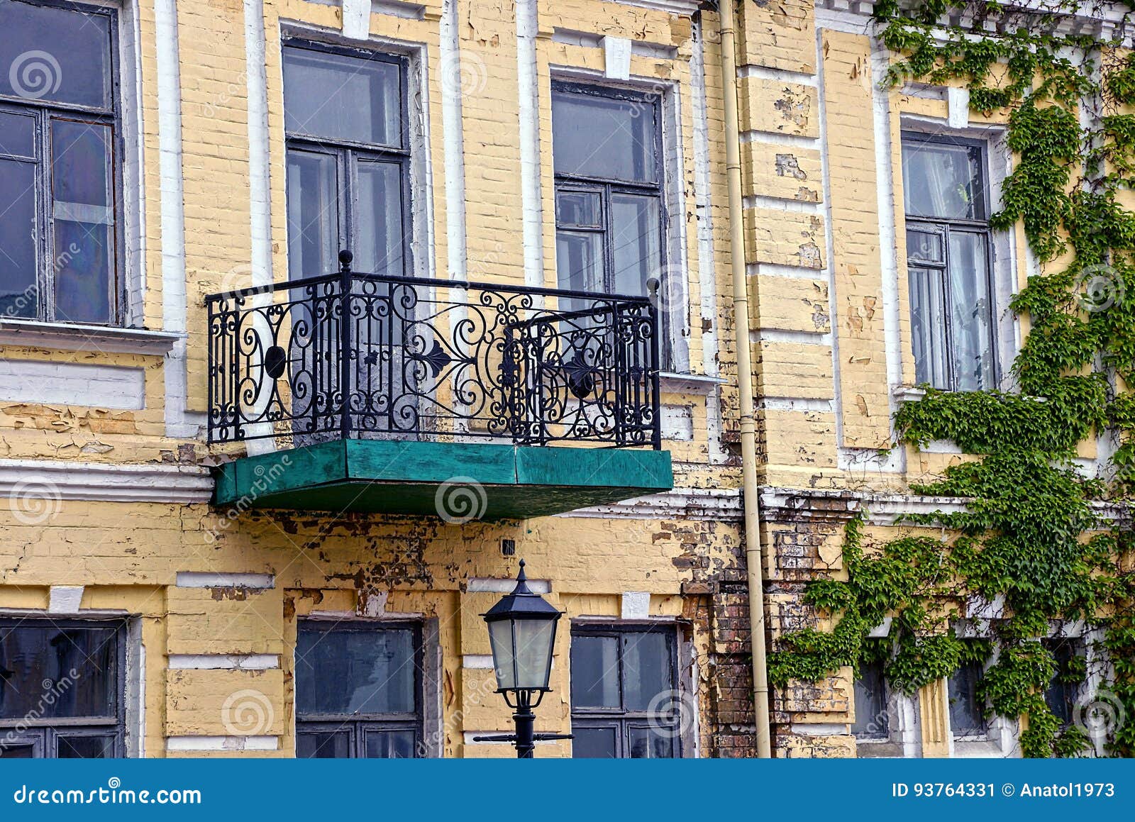 Old Open Balcony on the Facade of the Building Overgrown with Plants ...