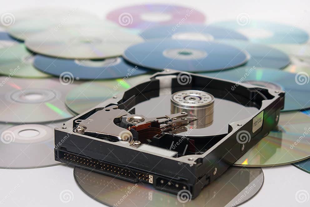 Old Opened Hard Disc on a Pile of Compact Discs Stock Photo - Image of ...