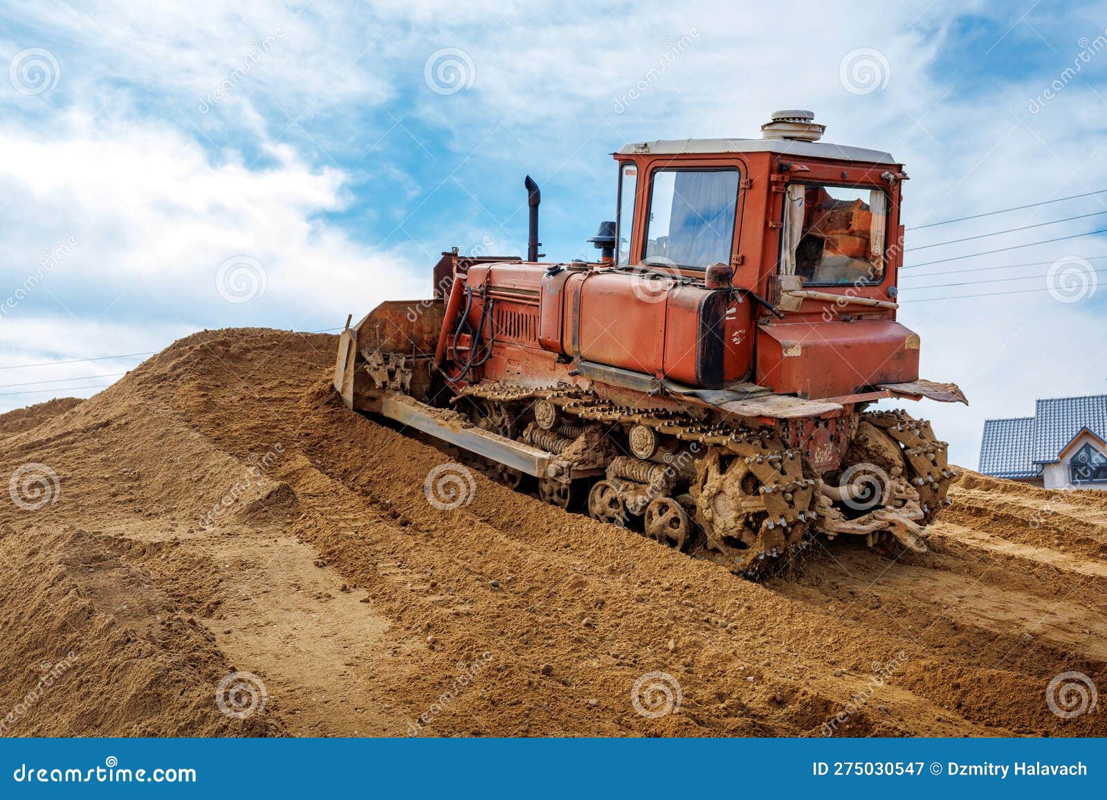 An Old Orange Bulldozer Performs Work To Level the Sandy Soil Stock ...