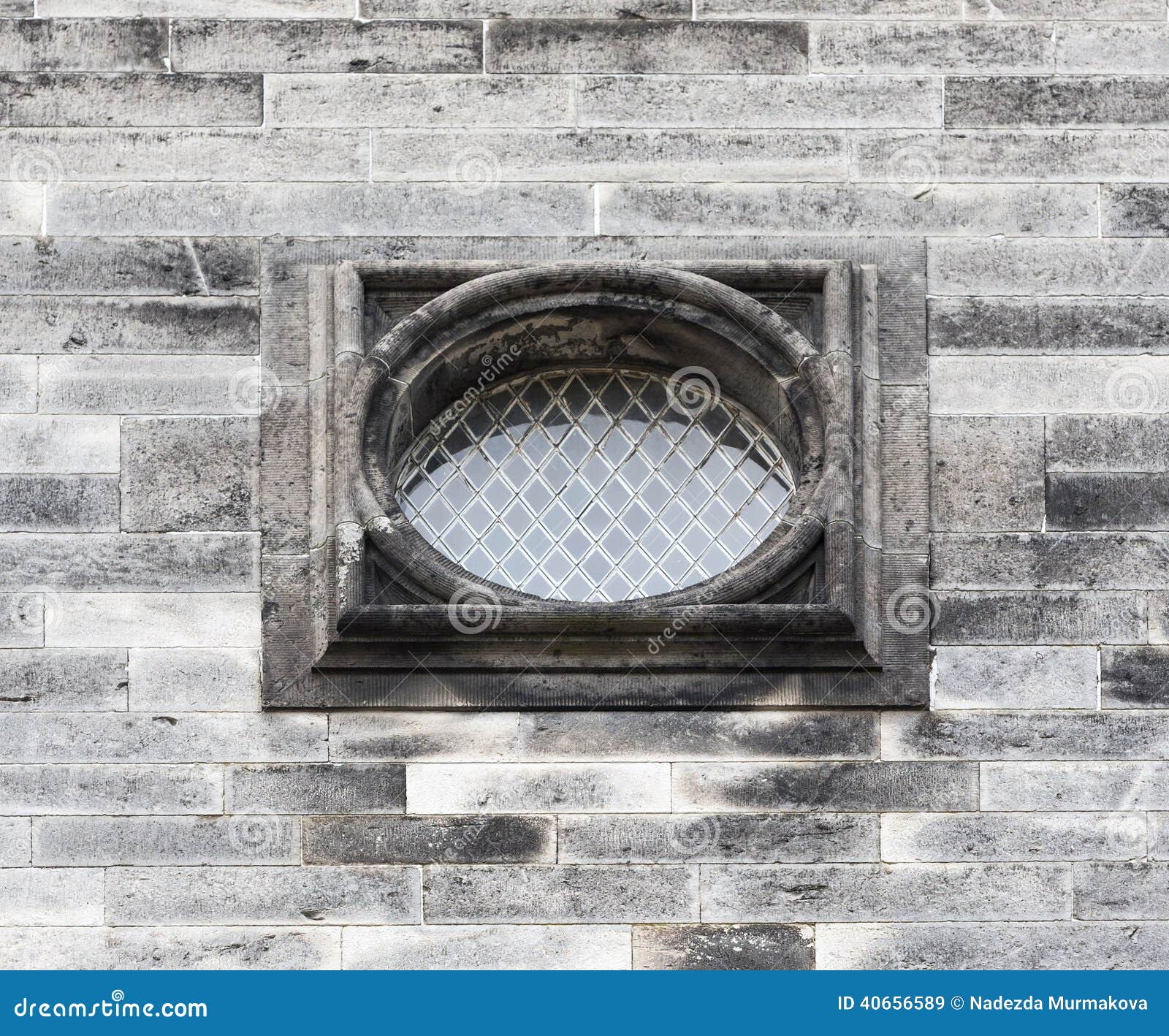 Old oval window with bars. stock image. Image of building - 40656589