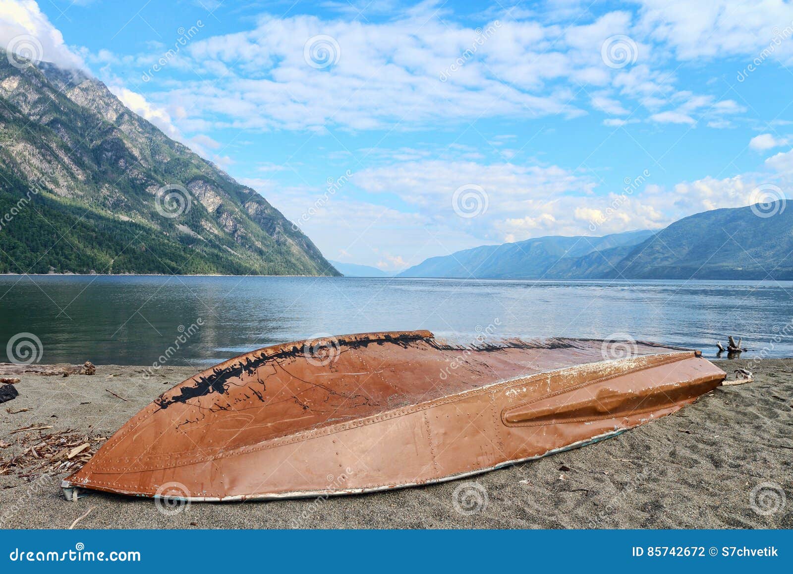 Old Overturned Boat on the Lake Stock Photo - Image of metallic, lake ...