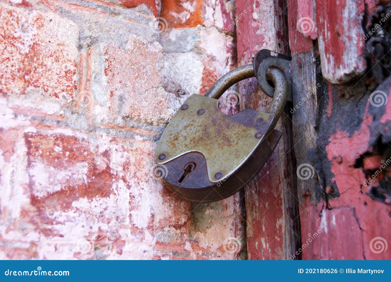 An Old Padlock on Closed Doors, a Rusty Lock on the Gate. Stock Photo ...
