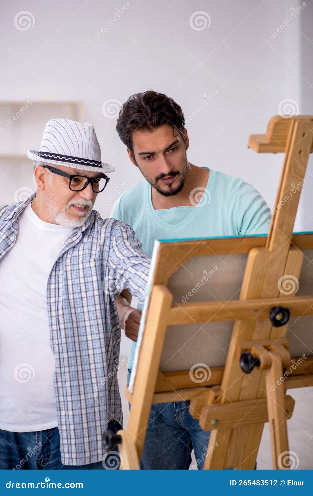 Old Painter Teaching Young Student at Studio Stock Photo - Image of ...