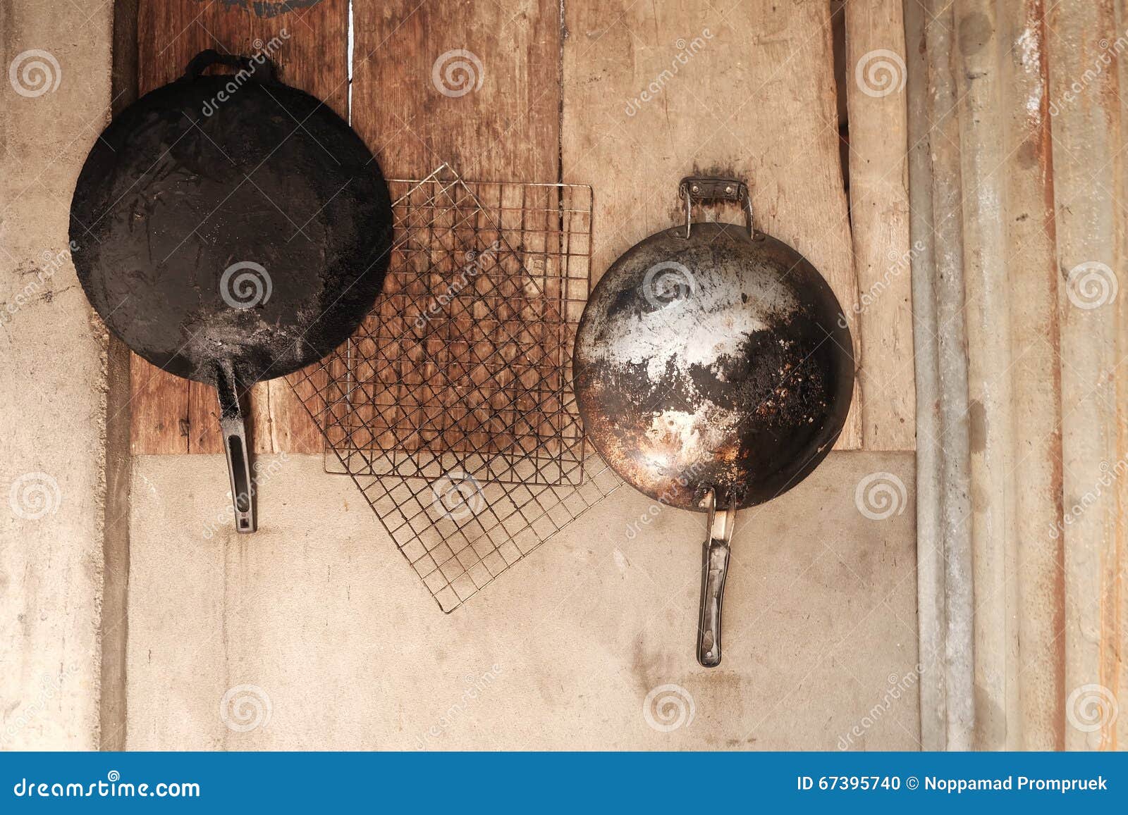 Old pan on wall stock photo. Image of food, metal, black - 67395740