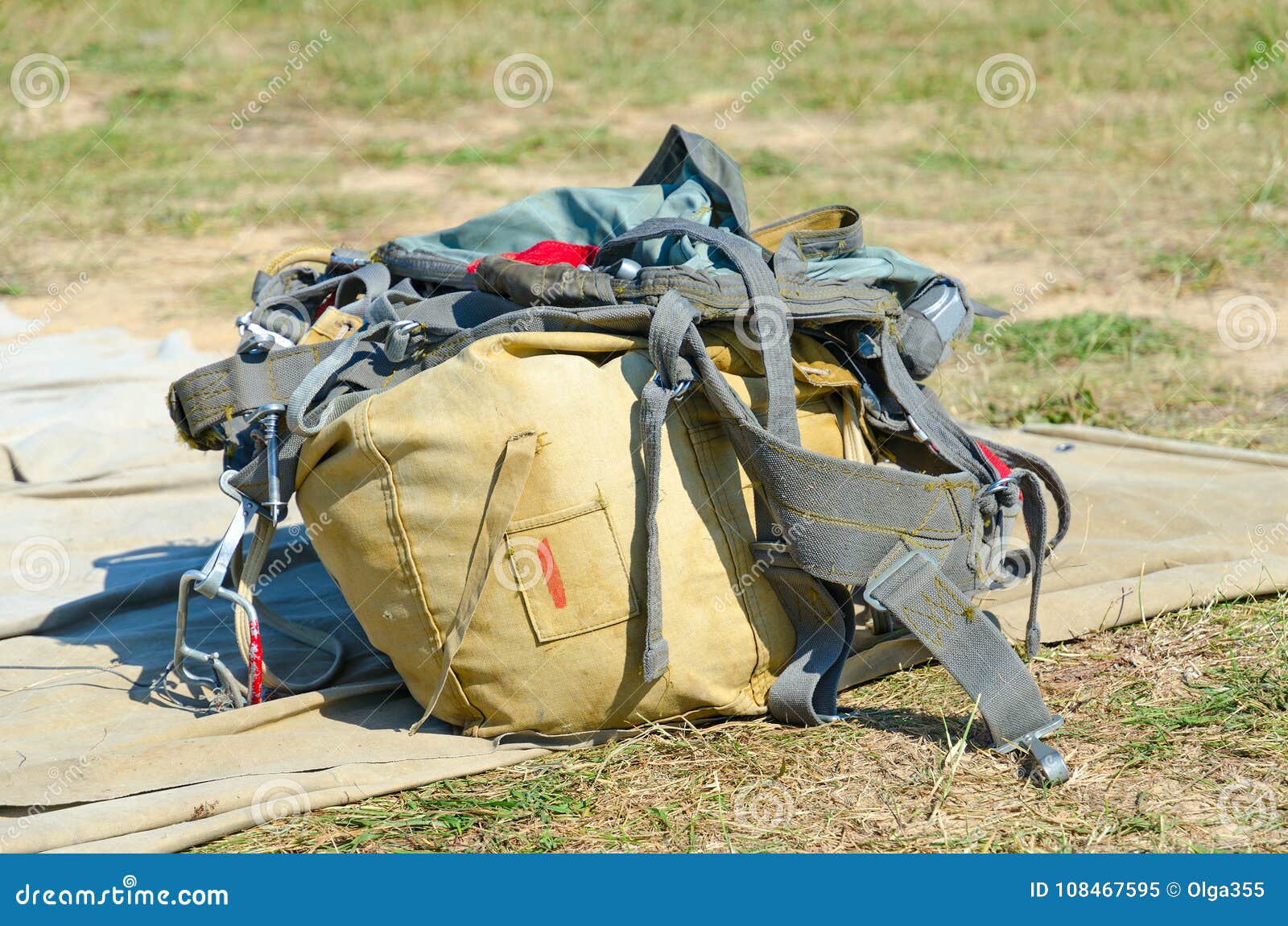 The Old Parachute Backpack on a Field Stock Image - Image of grass ...