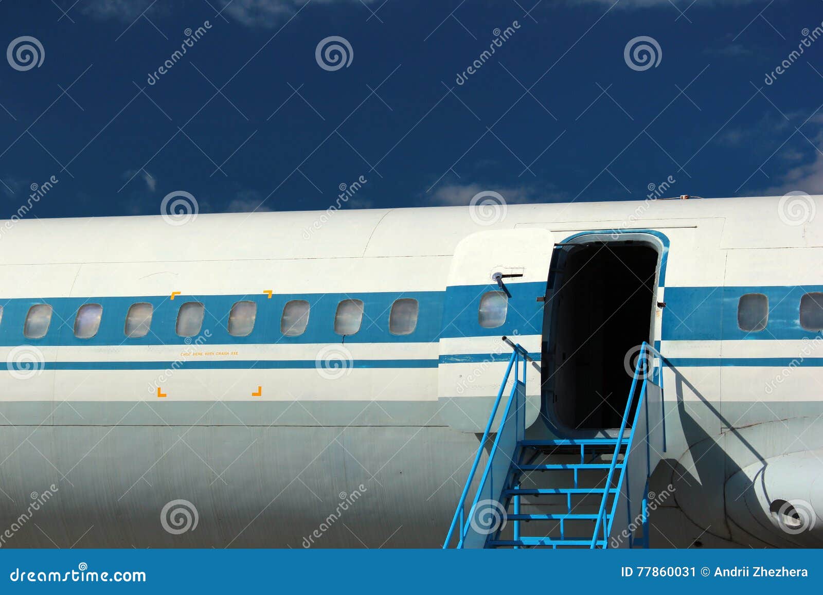 Old Passenger Aircraft Door and Windows Against Blue Sky Background ...