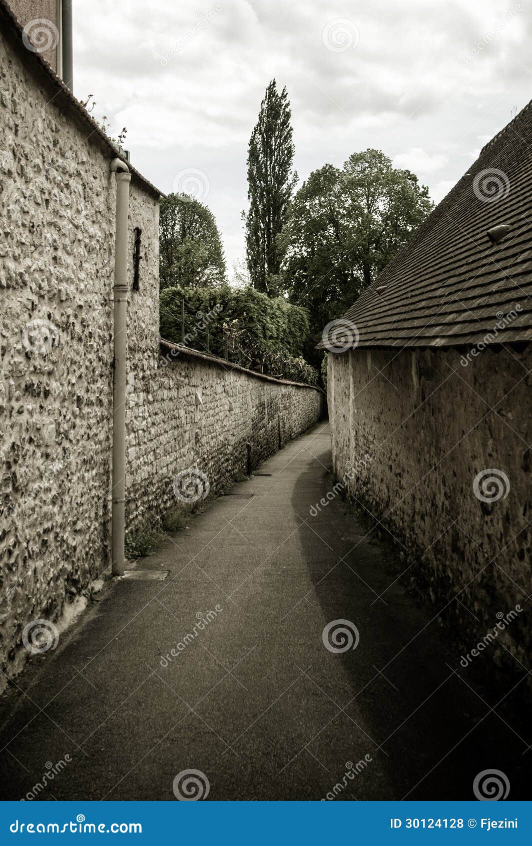 Path between stone houses stock photo. Image of houses - 30124128