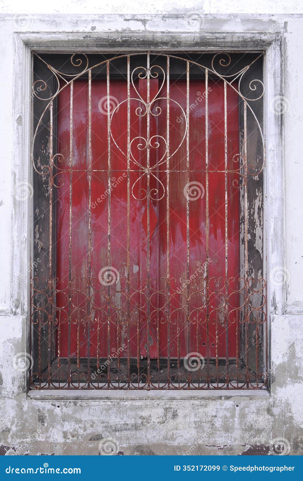 Old Pattern Rust Wrought Iron on Red Window Stock Image - Image of ...