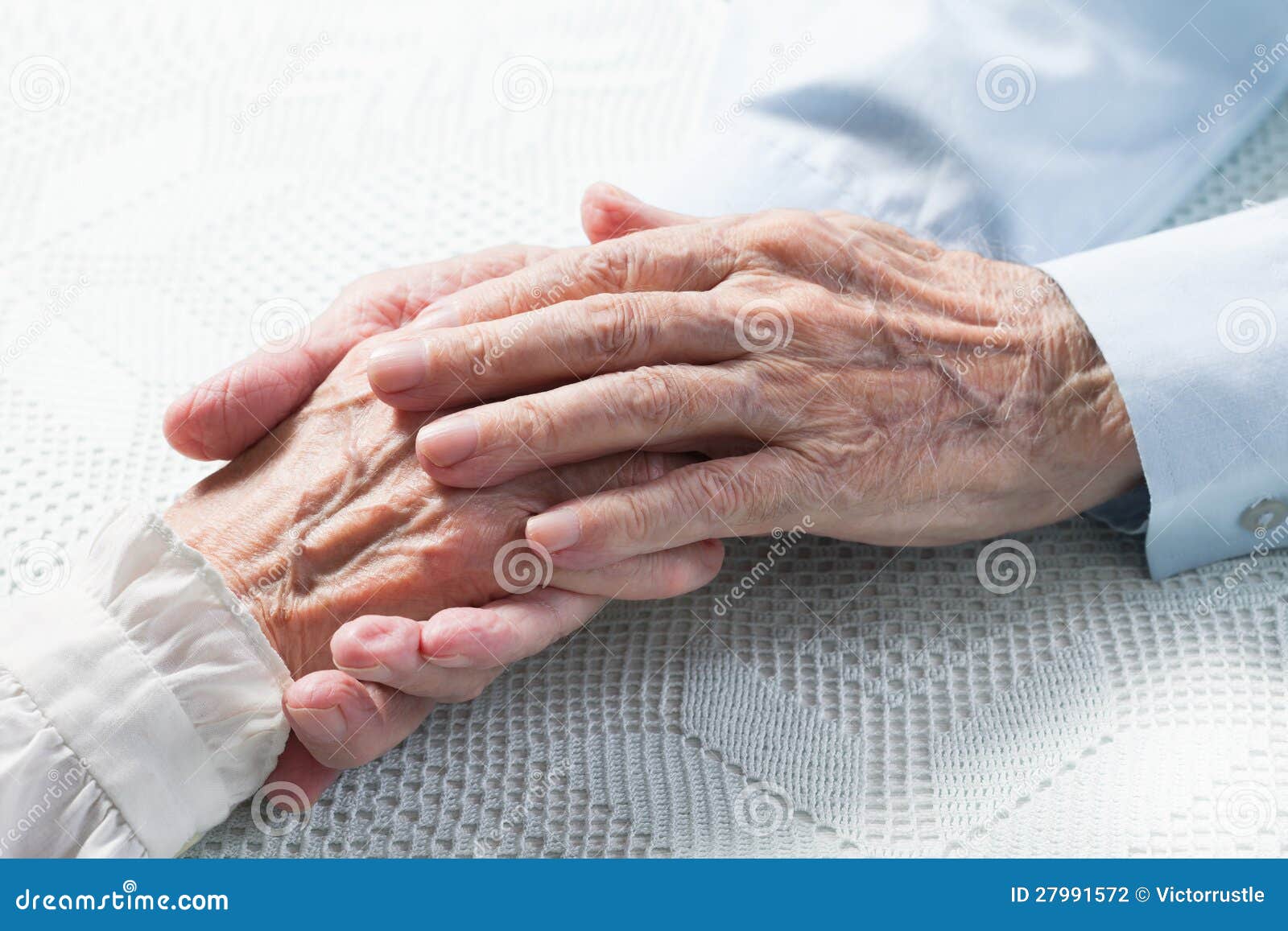 Old people holding hands stock photo. Image of woman - 27991572