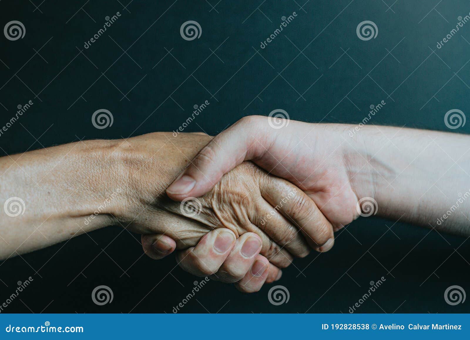 An Old Person and a Younger One Shaking Hands Stock Photo - Image of ...