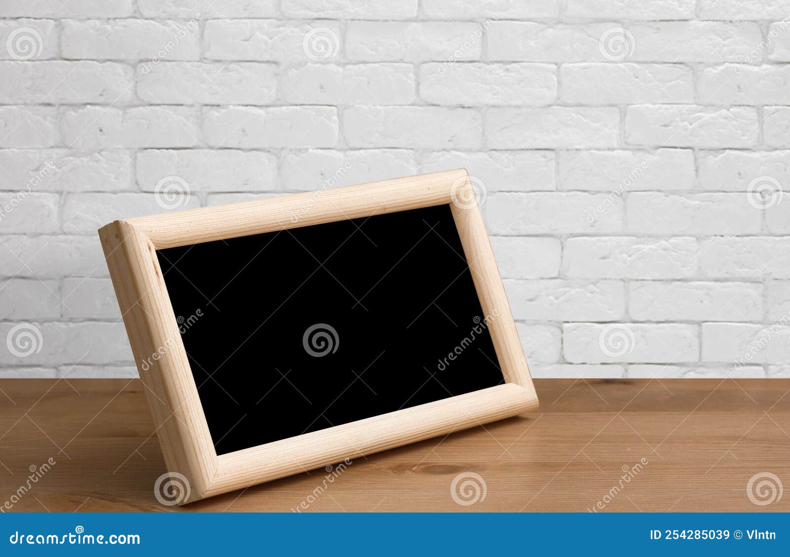 Photo frame on the table stock image. Image of space - 254285039