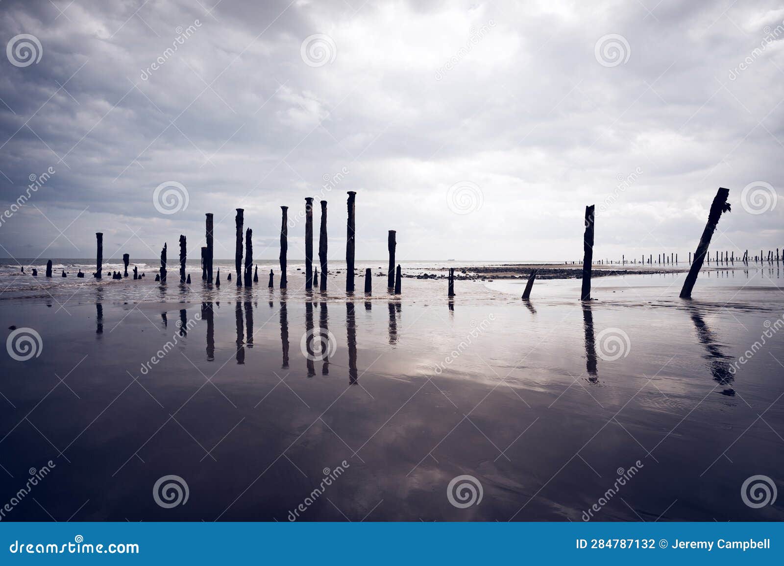 Old Pier Posts reflected stock photo. Image of reflection - 284787132