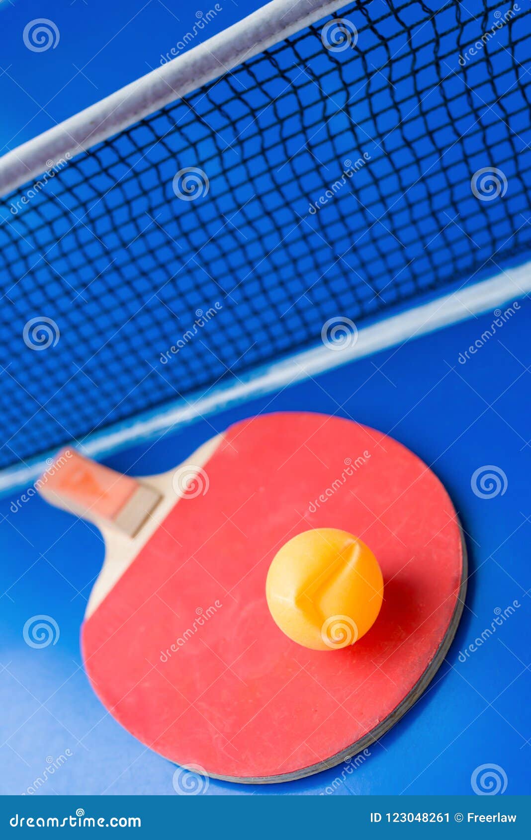 Old Pingpong Racket and a Dented Ball on Blue Pingpong Table Stock ...