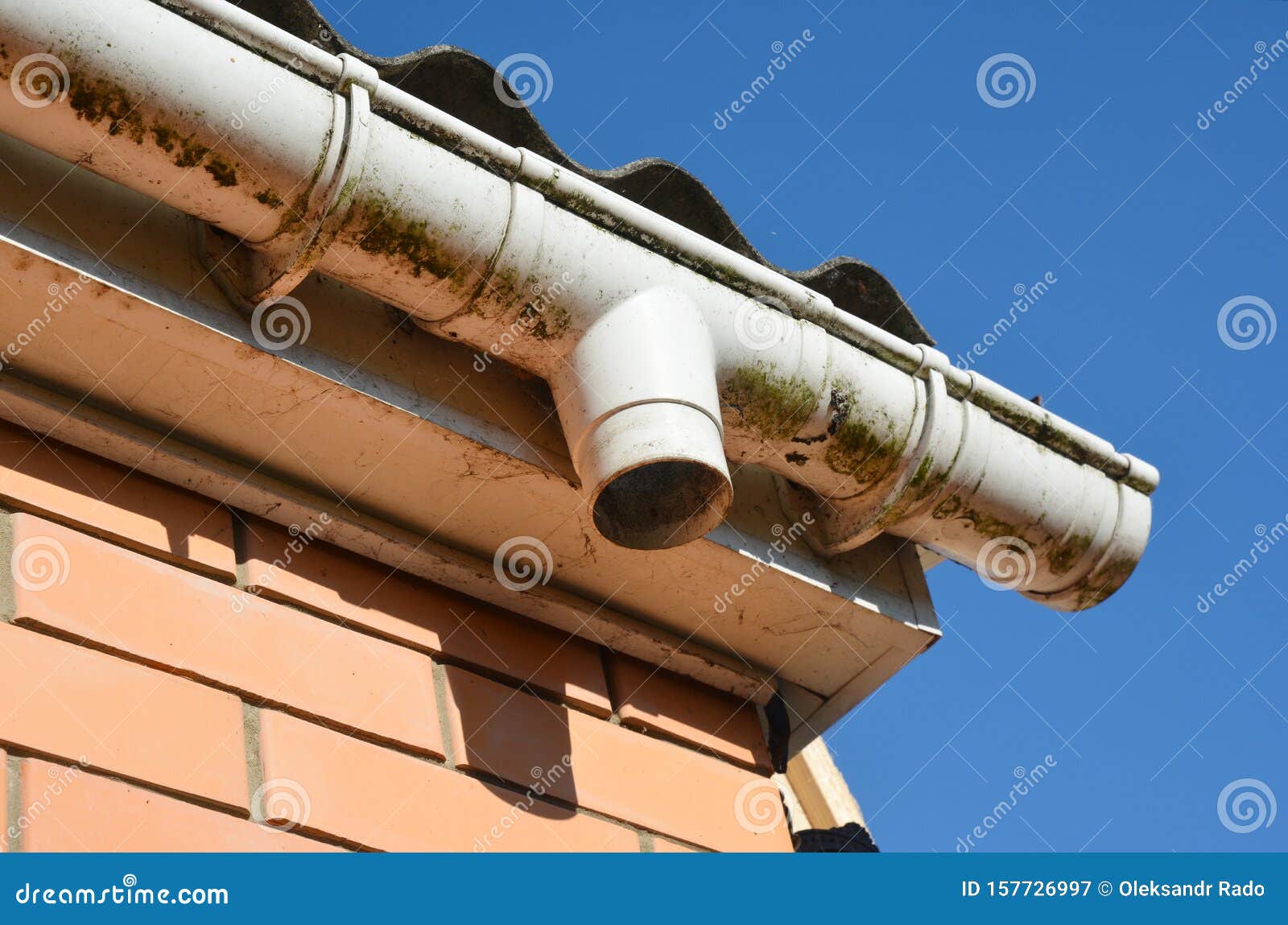 Roof Gutter Repair. Rain Gutter Installation With Drain Downspout Pipe ...