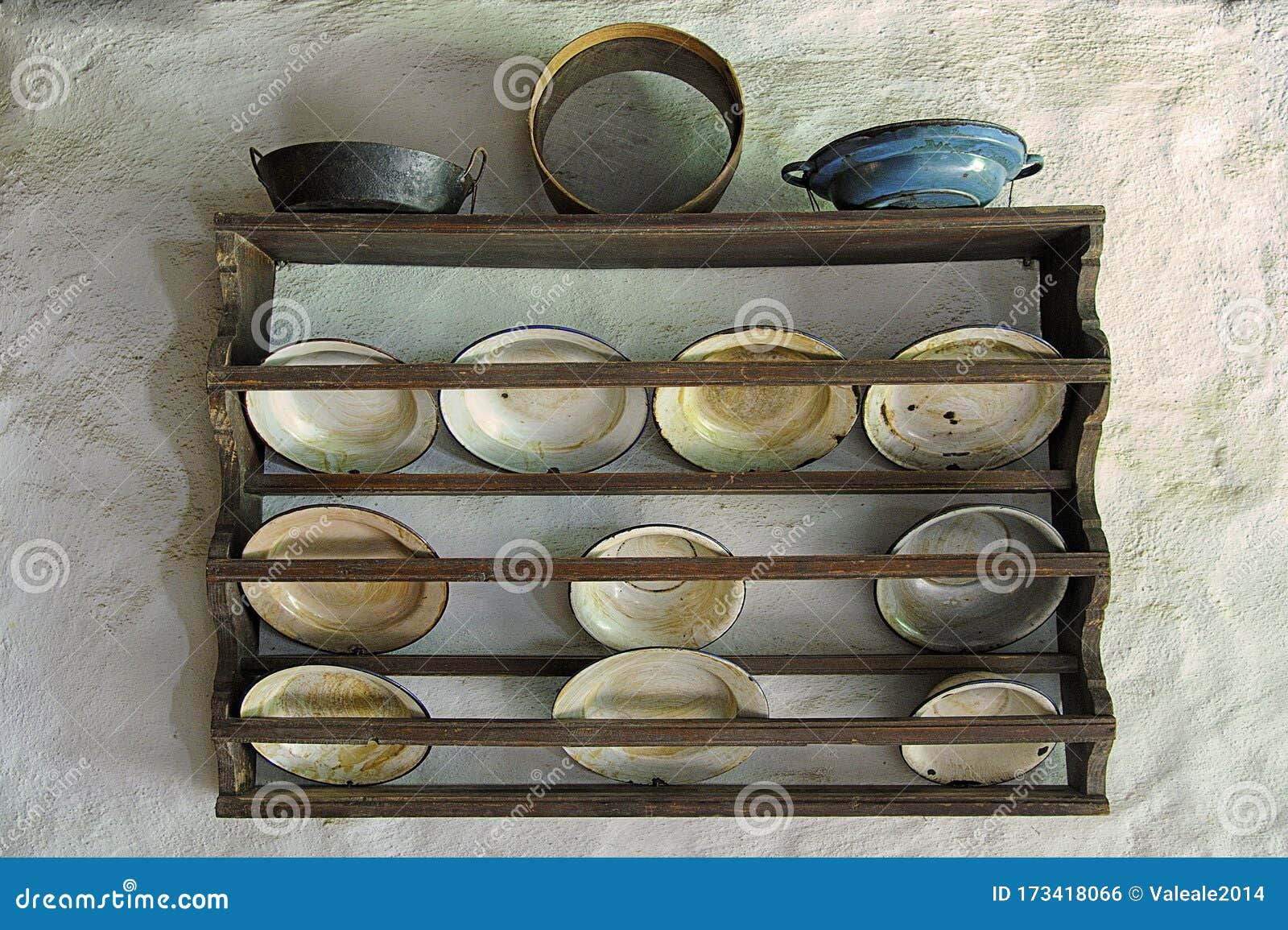 Old Plates on a Wall in a Kitchen Stock Photo - Image of wooden, table ...