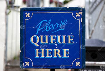 Old Please Queue here sign stock image. Image of demand - 20325055