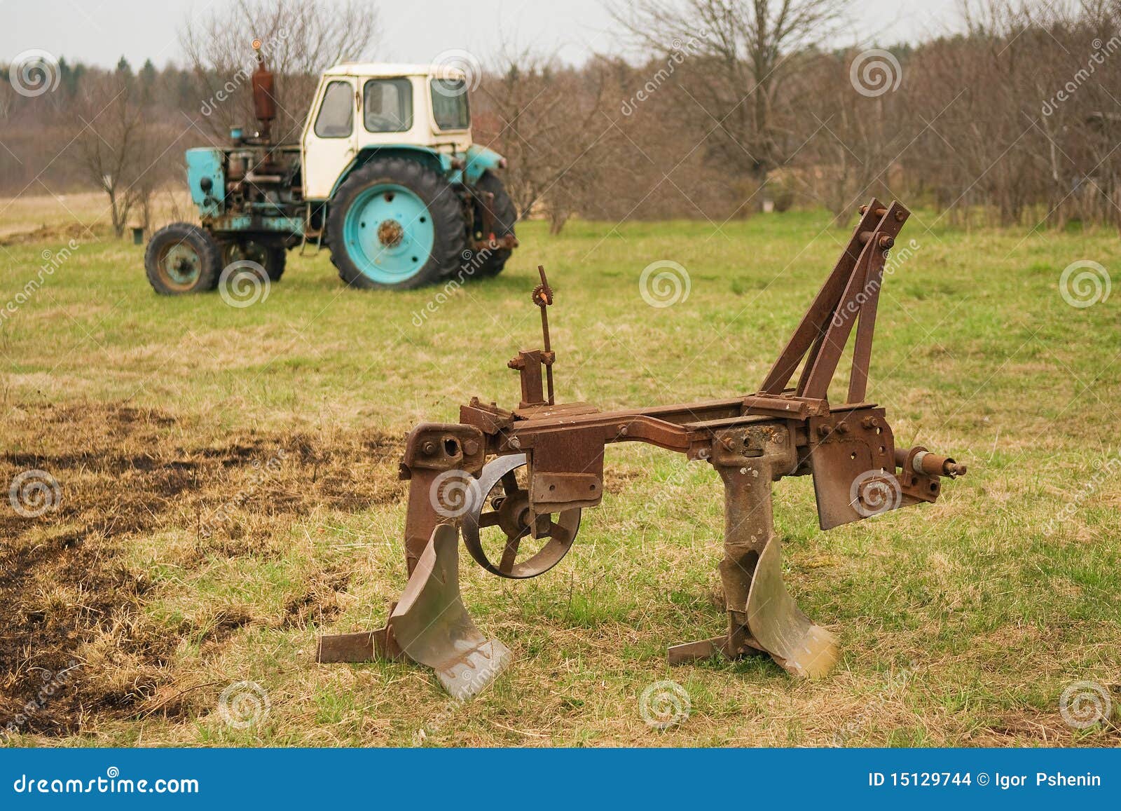 Old plow and tractor stock photo. Image of agricultural - 15129744
