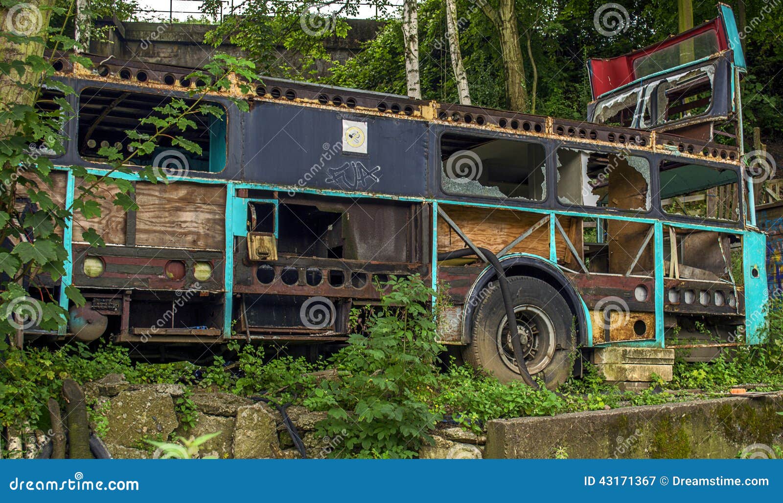 Old, Post Apocalyptic Looking Decayed and Rotting Bus in the Woods ...