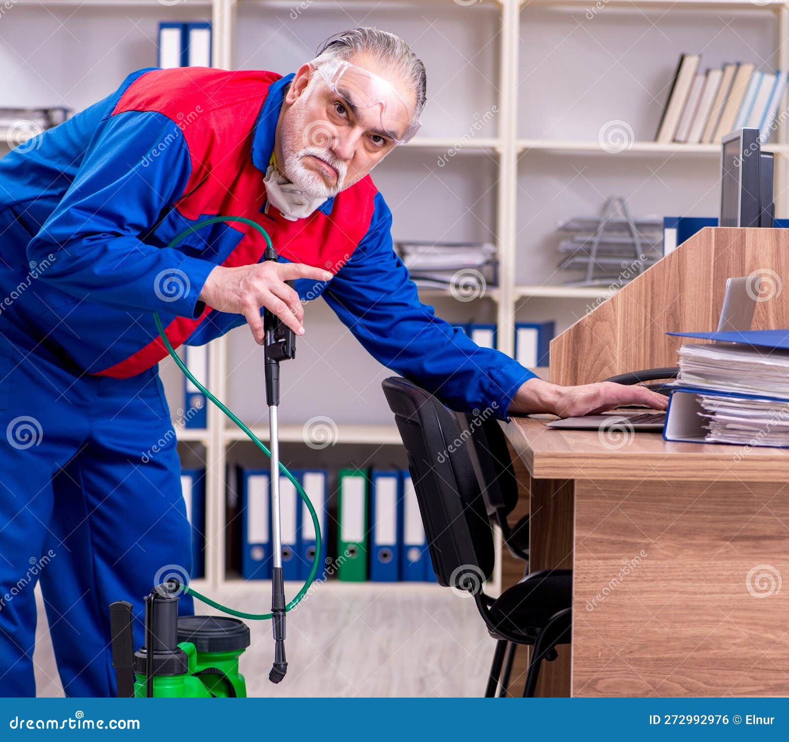 Old Professional Contractor Doing Pest Control in the Office Stock ...