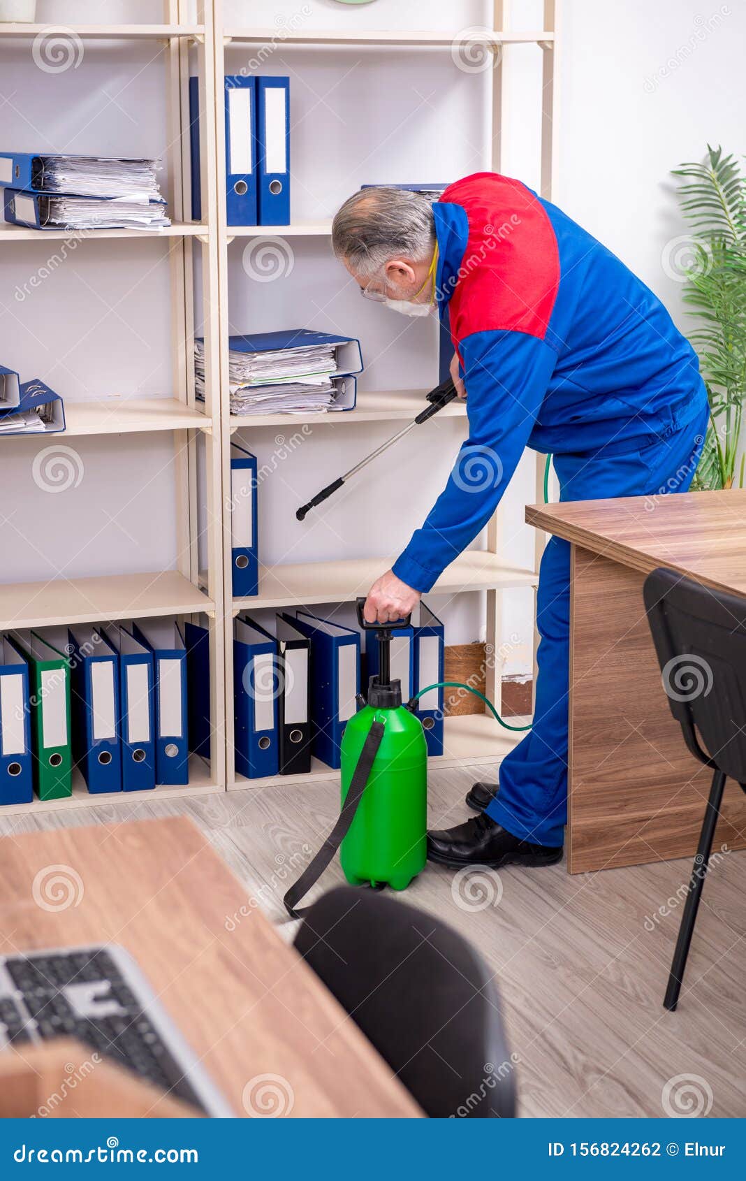 Old Professional Contractor Doing Pest Control in the Office Stock ...