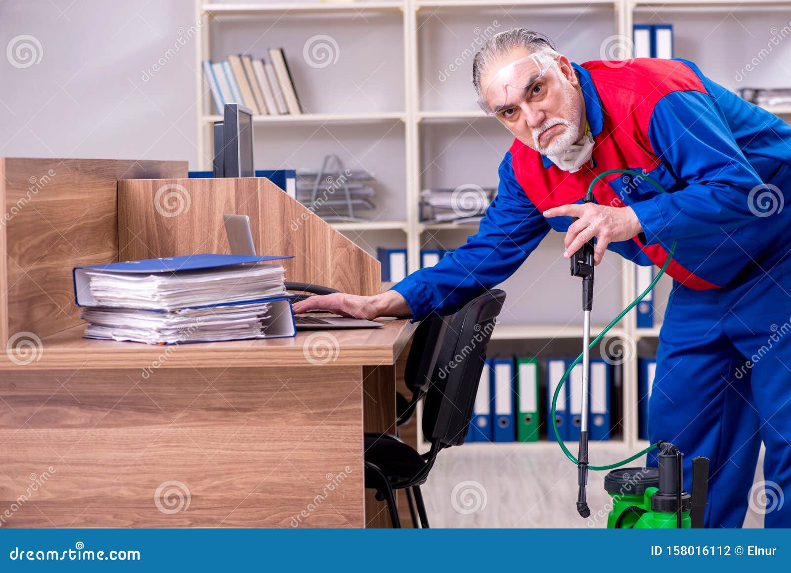 Old Professional Contractor Doing Pest Control in the Office Stock ...