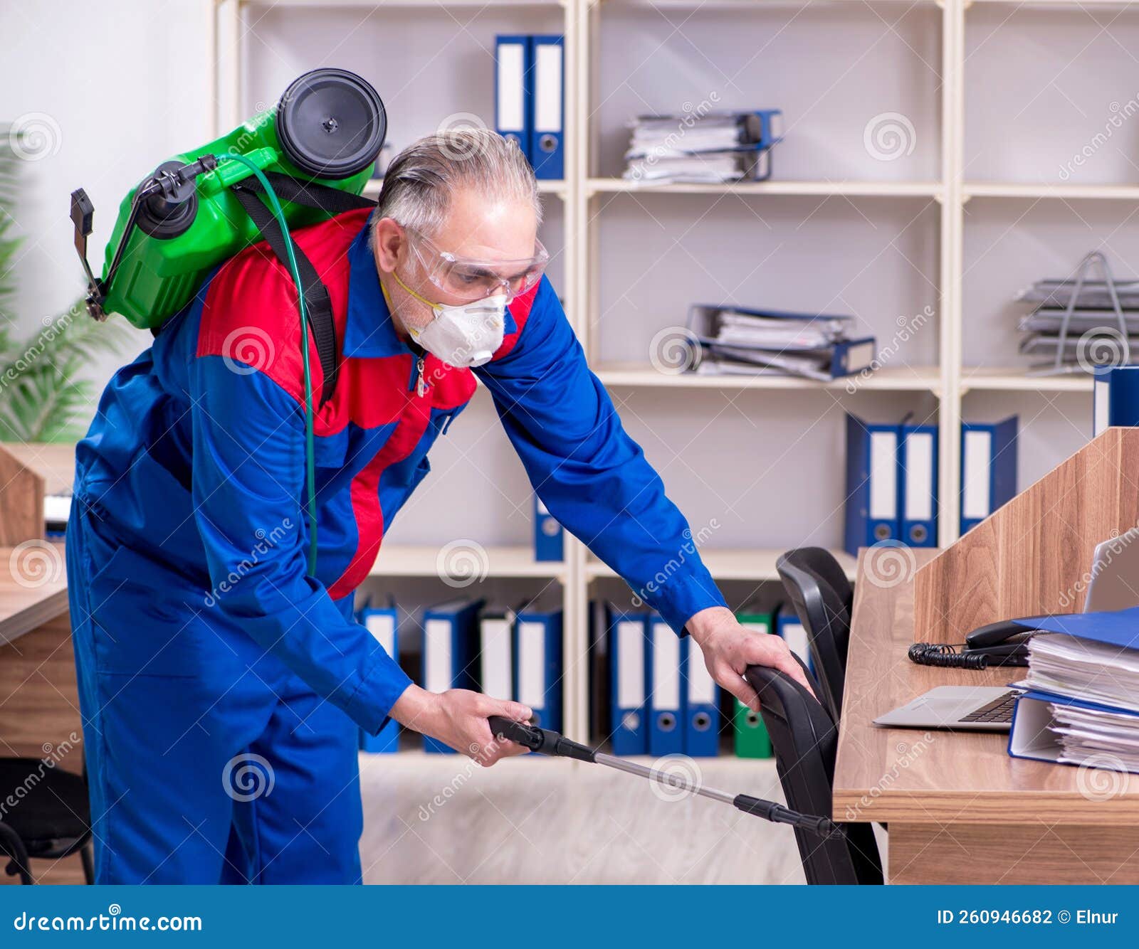 Old Professional Contractor Doing Pest Control in the Office Stock ...