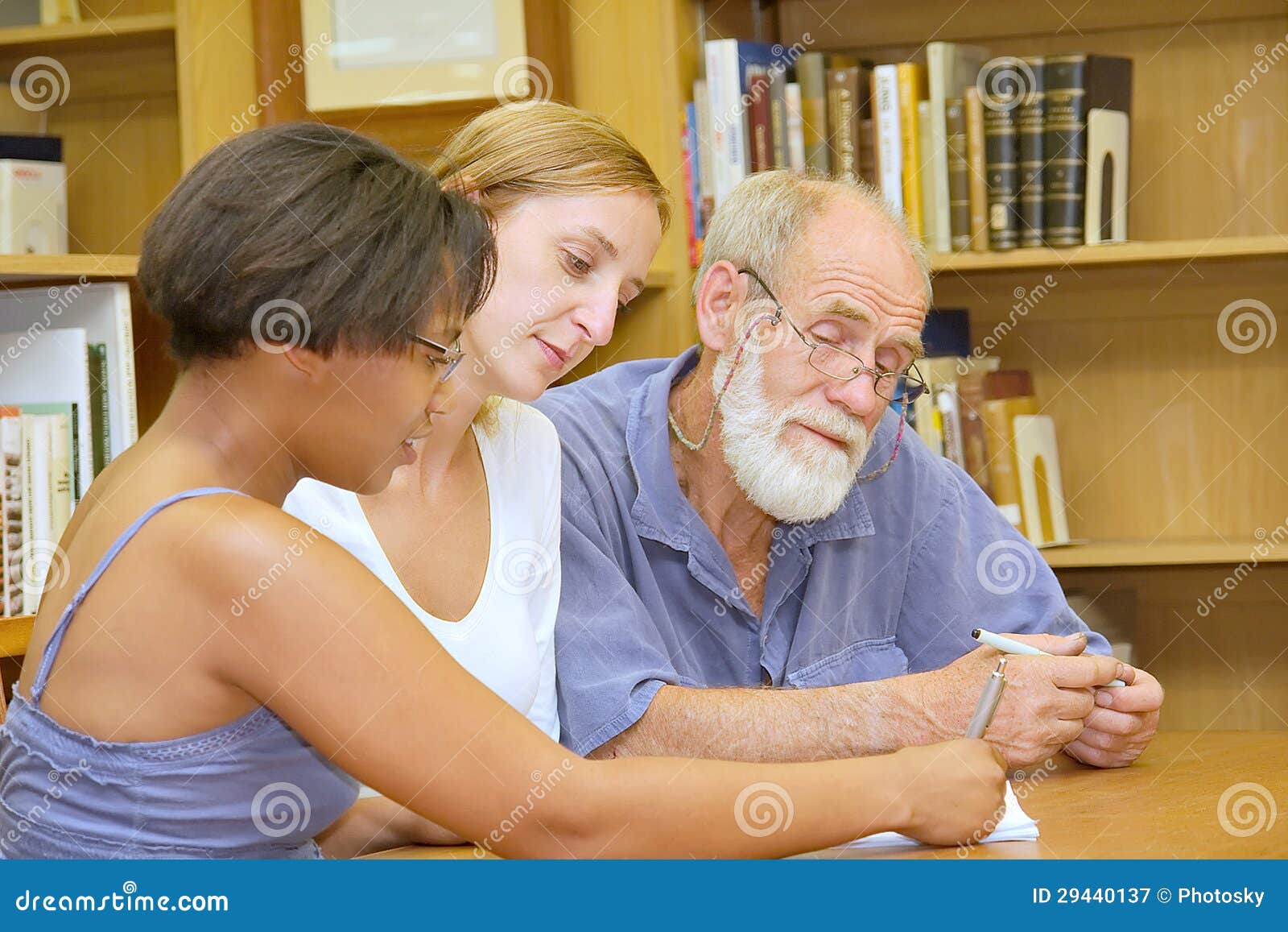 Old Professor with Multiracial Group Studying in Library Stock Image ...